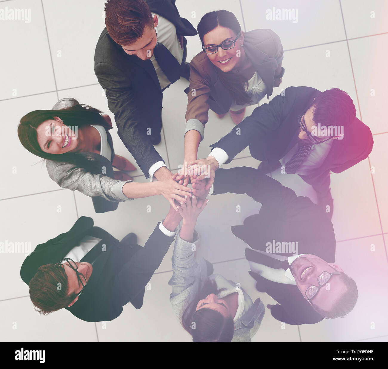 top view.business team making tower out of hands Stock Photo - Alamy