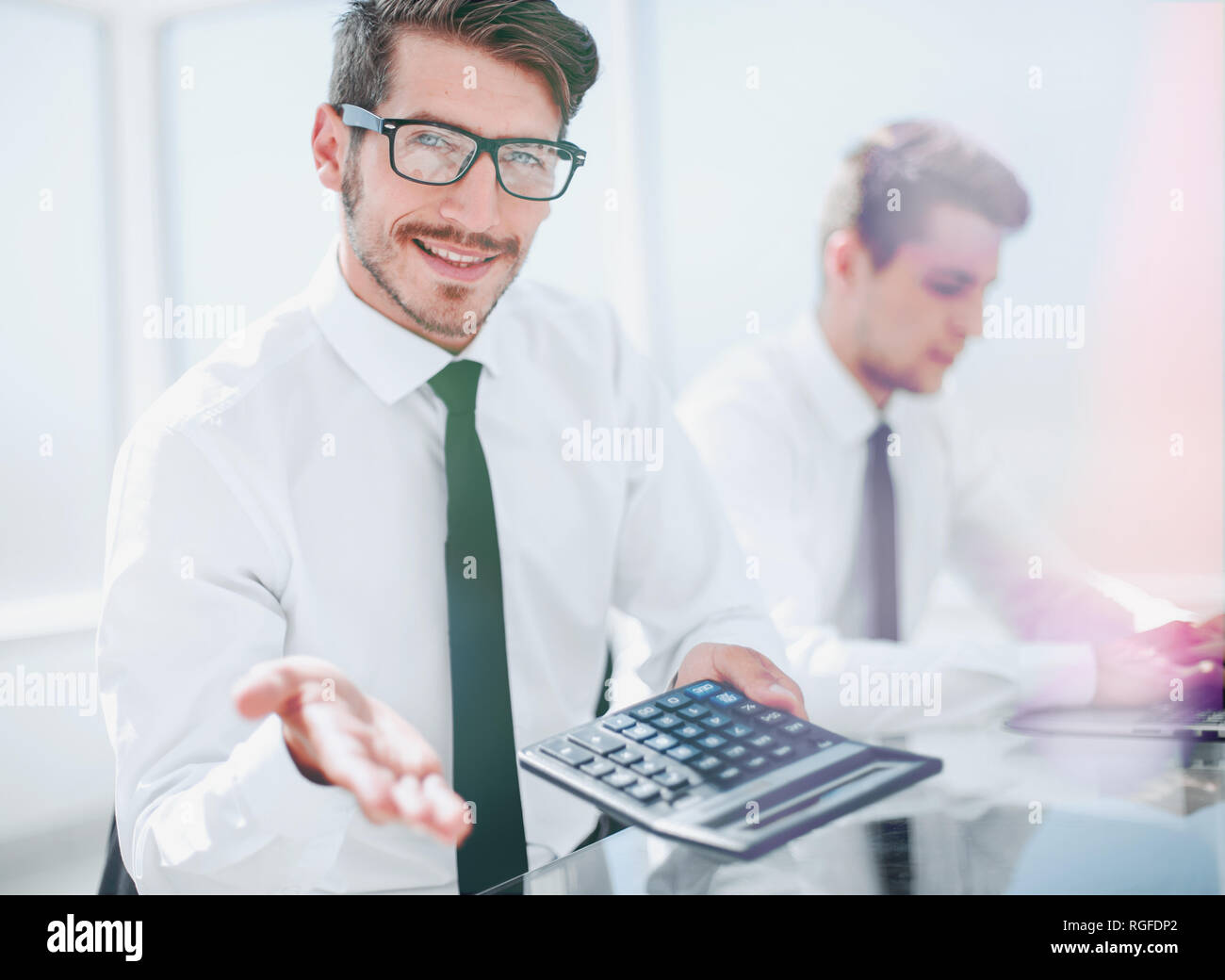 man counting expenses using calculator with laptop on table. Fin Stock ...