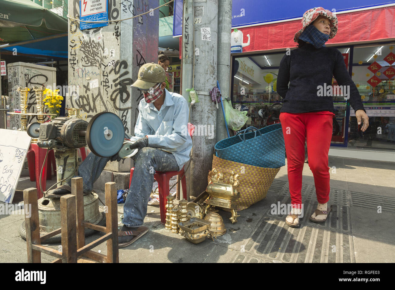 Street copper polisher in Ho Chi Minh, Vietnam Stock Photo - Alamy