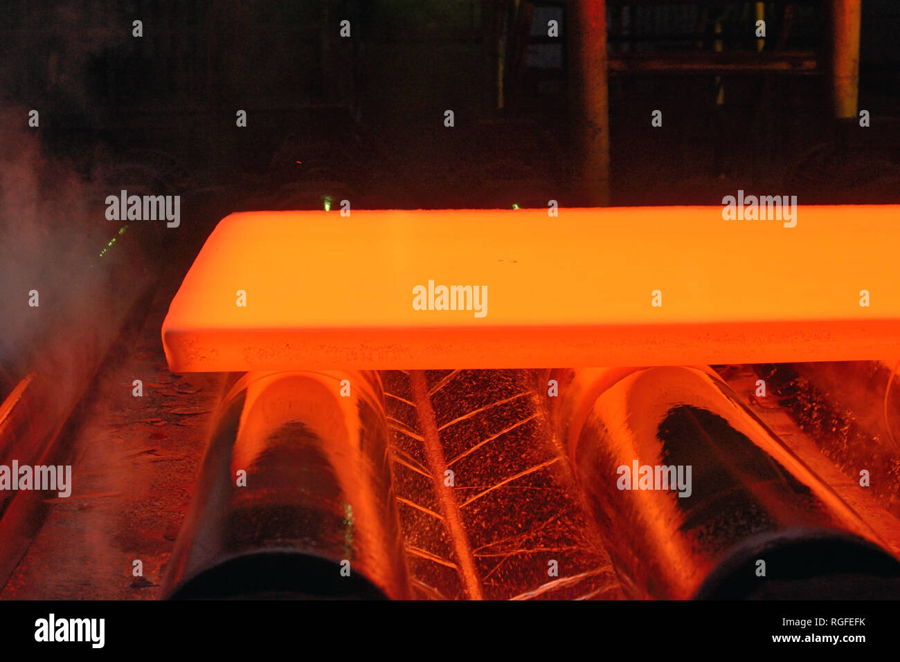 hot steel plate on conveyor Stock Photo - Alamy