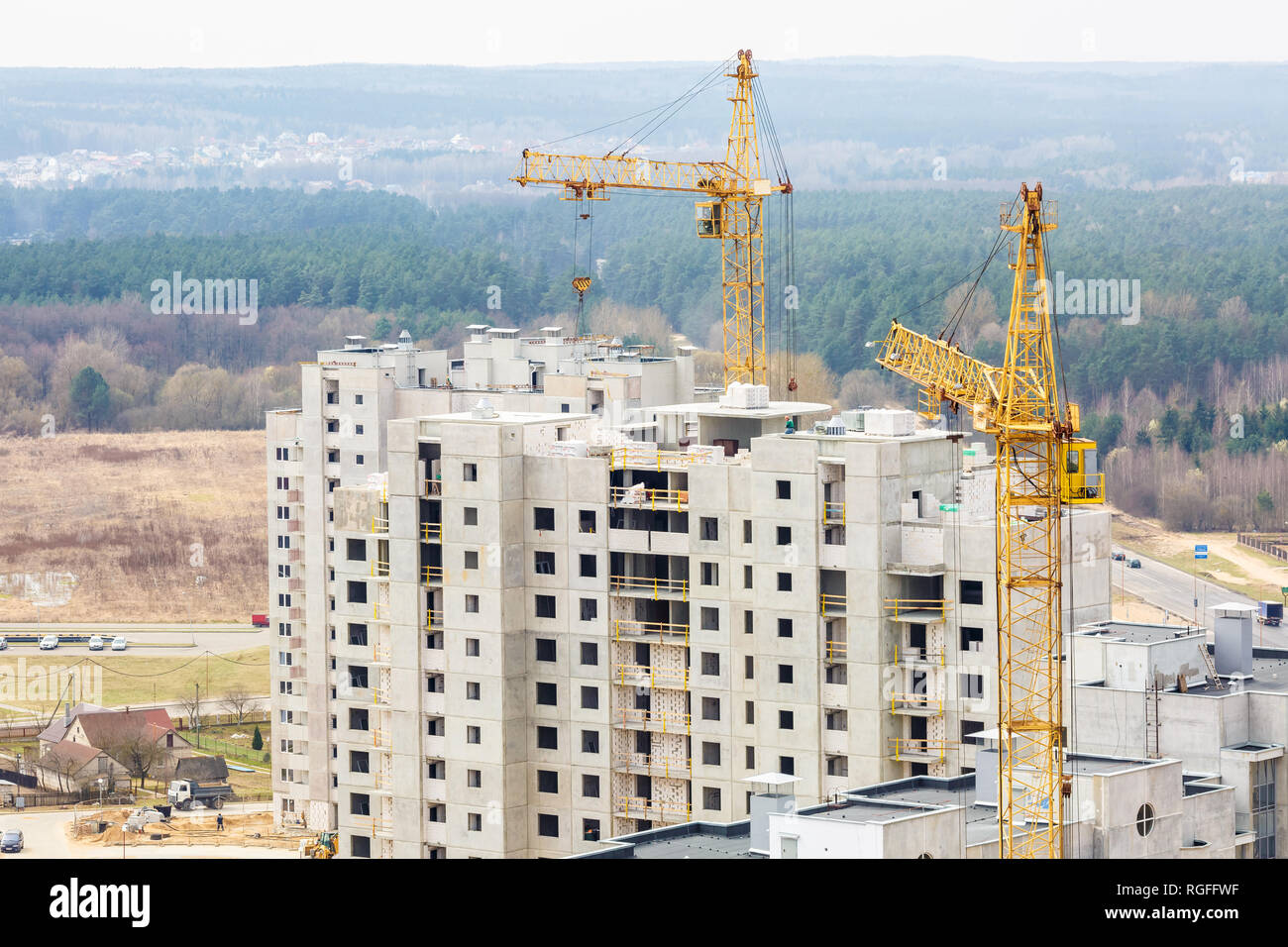 Panoramic view on Tower cranes and unfinished multi-storey high near ...
