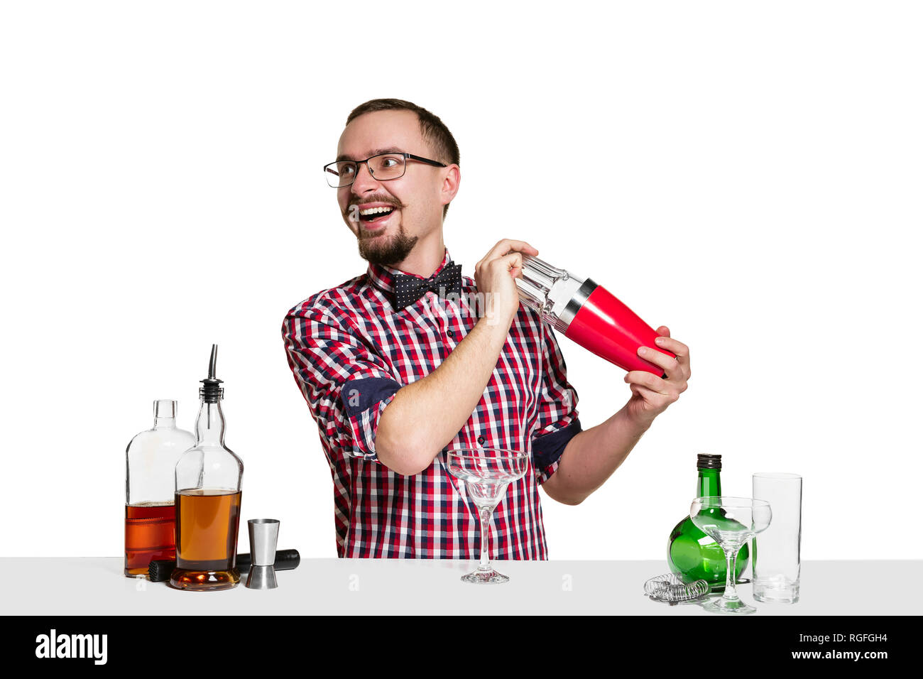 Expert male barman is making cocktail at studio isolated on white ...