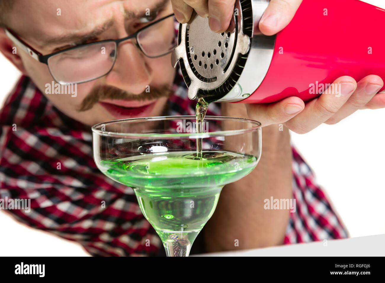 Expert male barman is making cocktail at studio isolated on white ...