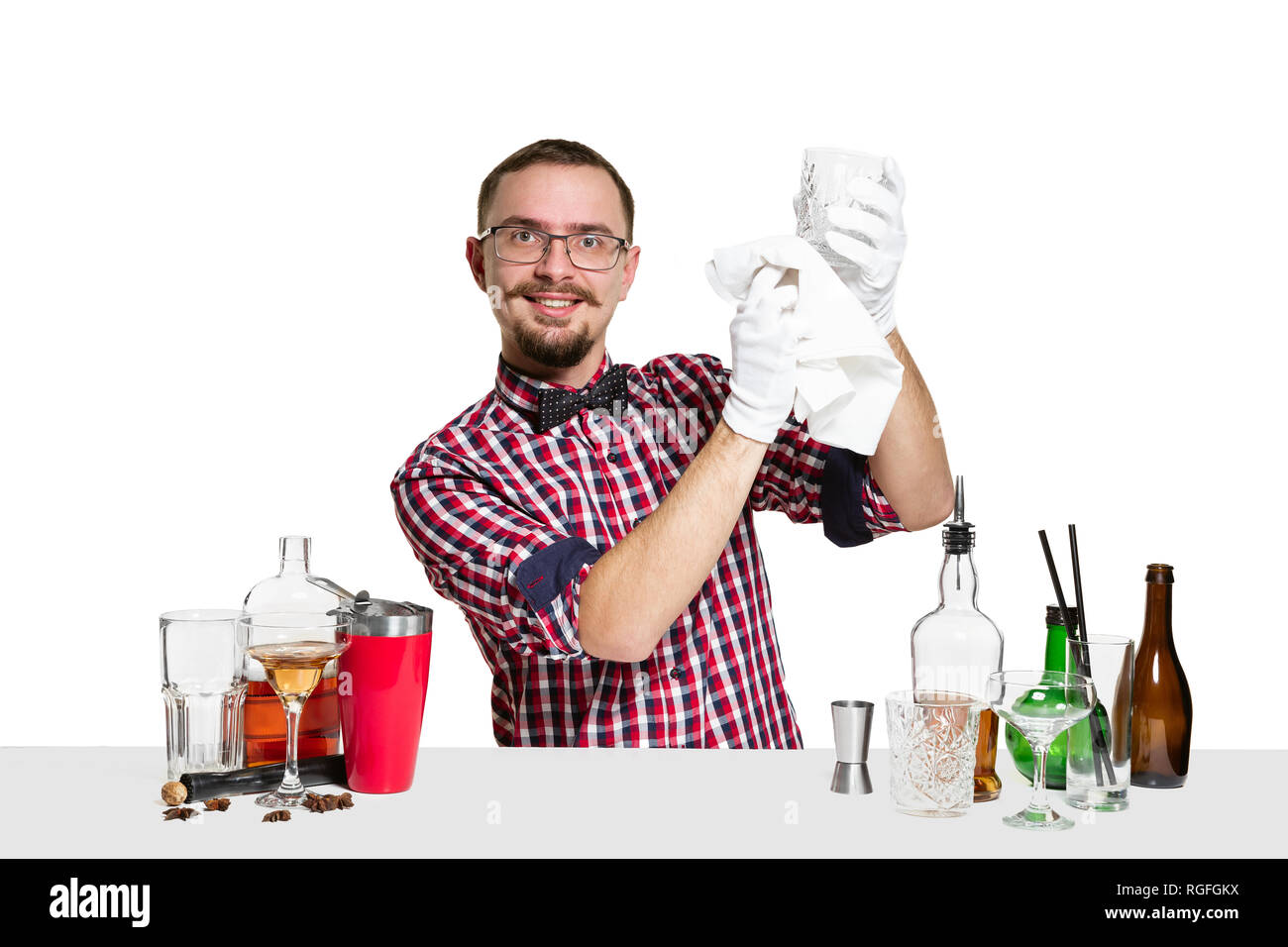 Expert male barman is making cocktail at studio isolated on white ...