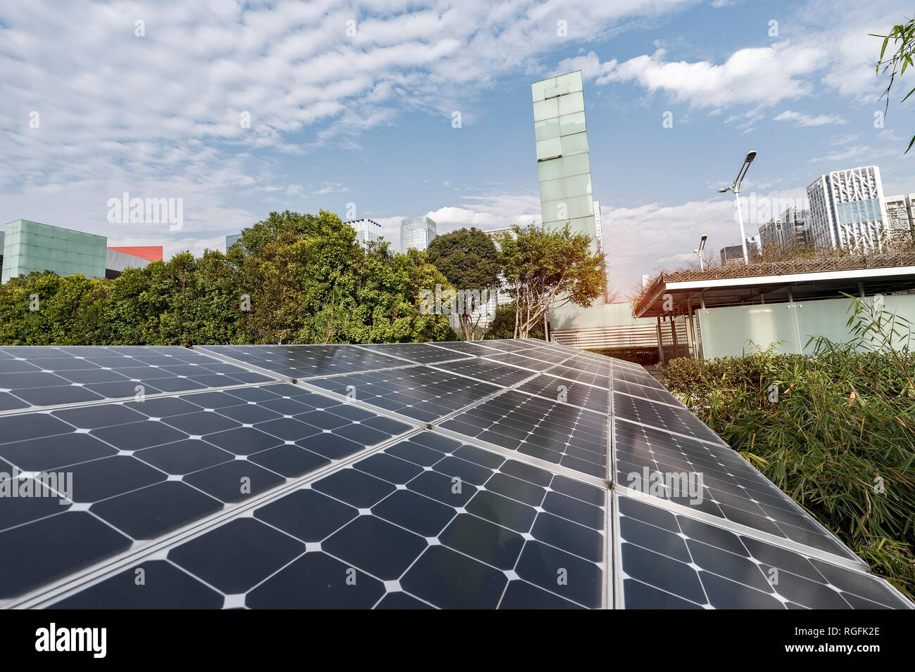Ecological energy renewable solar panel plant with urban landscape ...