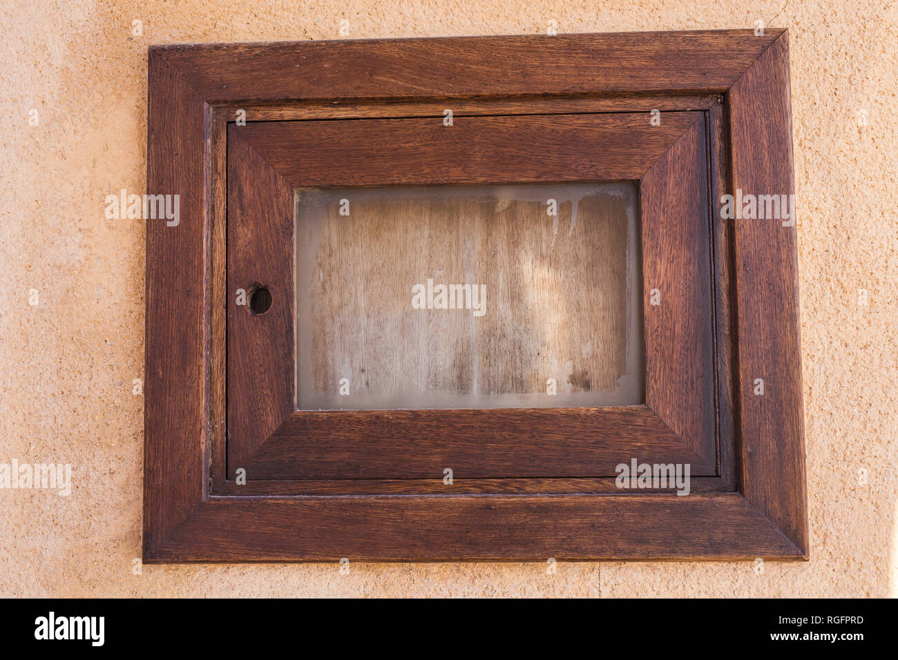 Small closed window in the stone wall Stock Photo - Alamy
