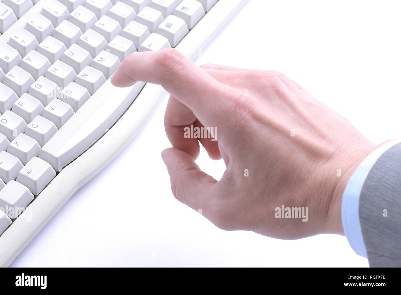 finger hit the button on the old computer keyboard Stock Photo - Alamy