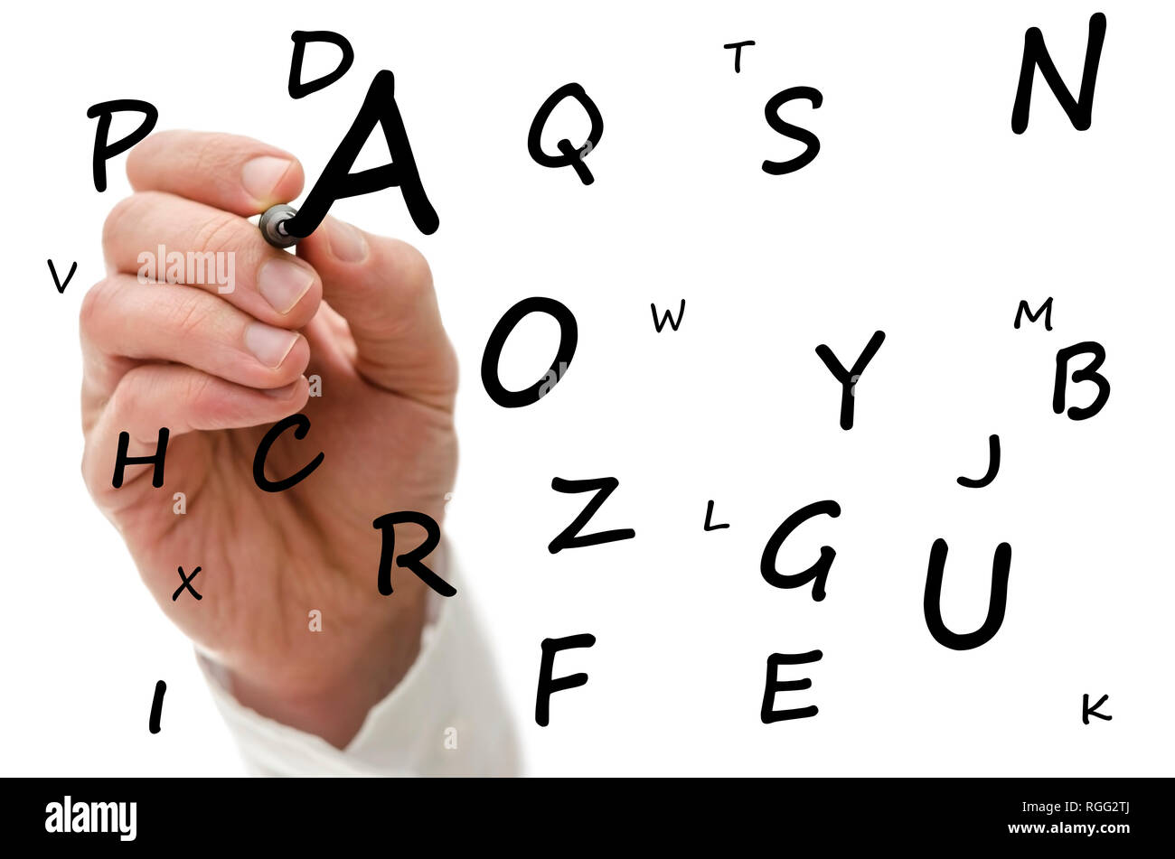 Closeup of male hand writing letters of alphabet on virtual screen ...