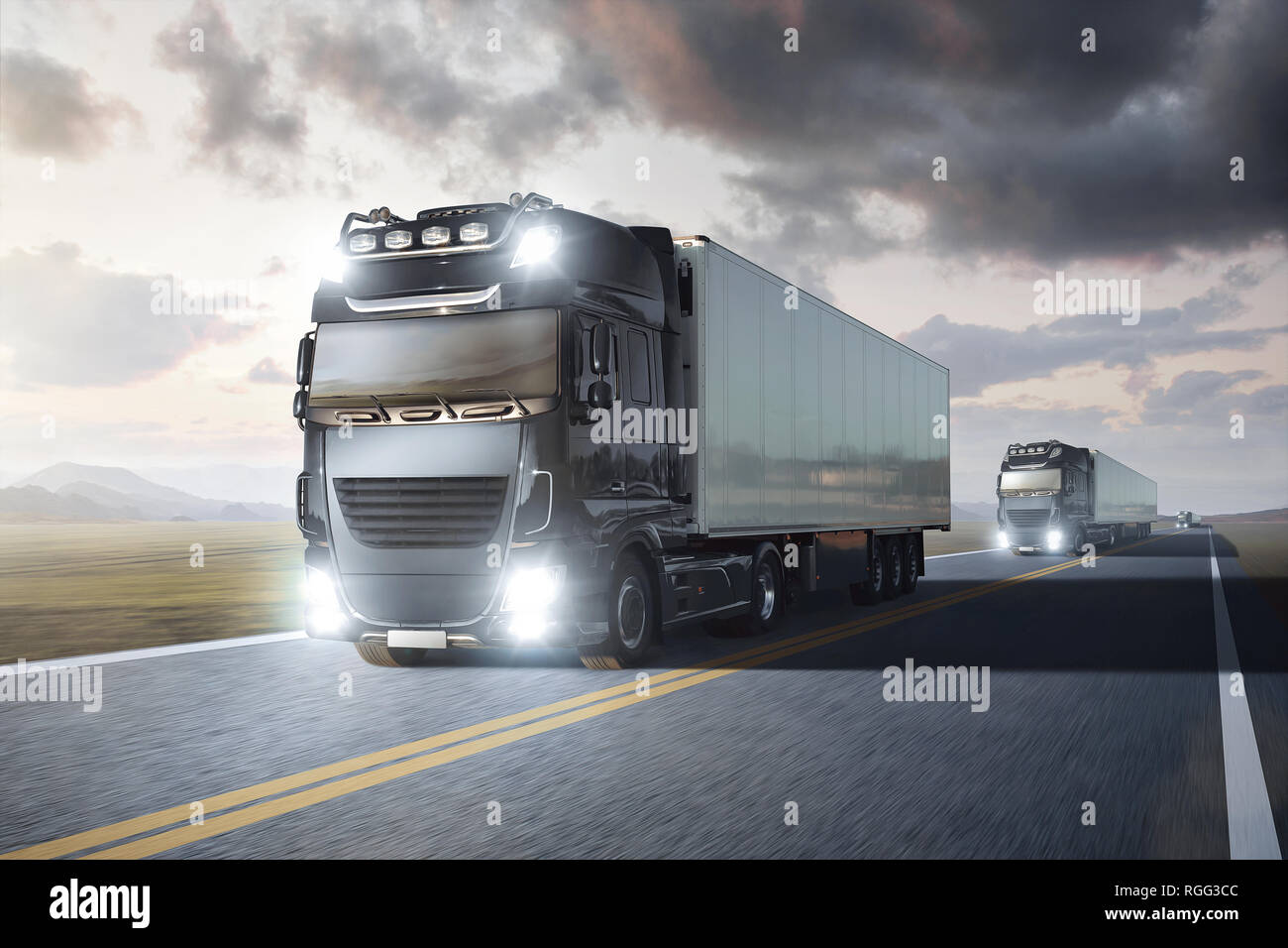 Multiple trucks with trailer driving on a remote highway through a ...