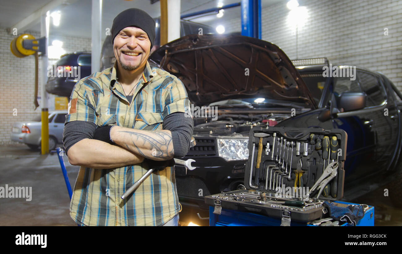 Car service brutal mechanic man hi-res stock photography and images - Alamy