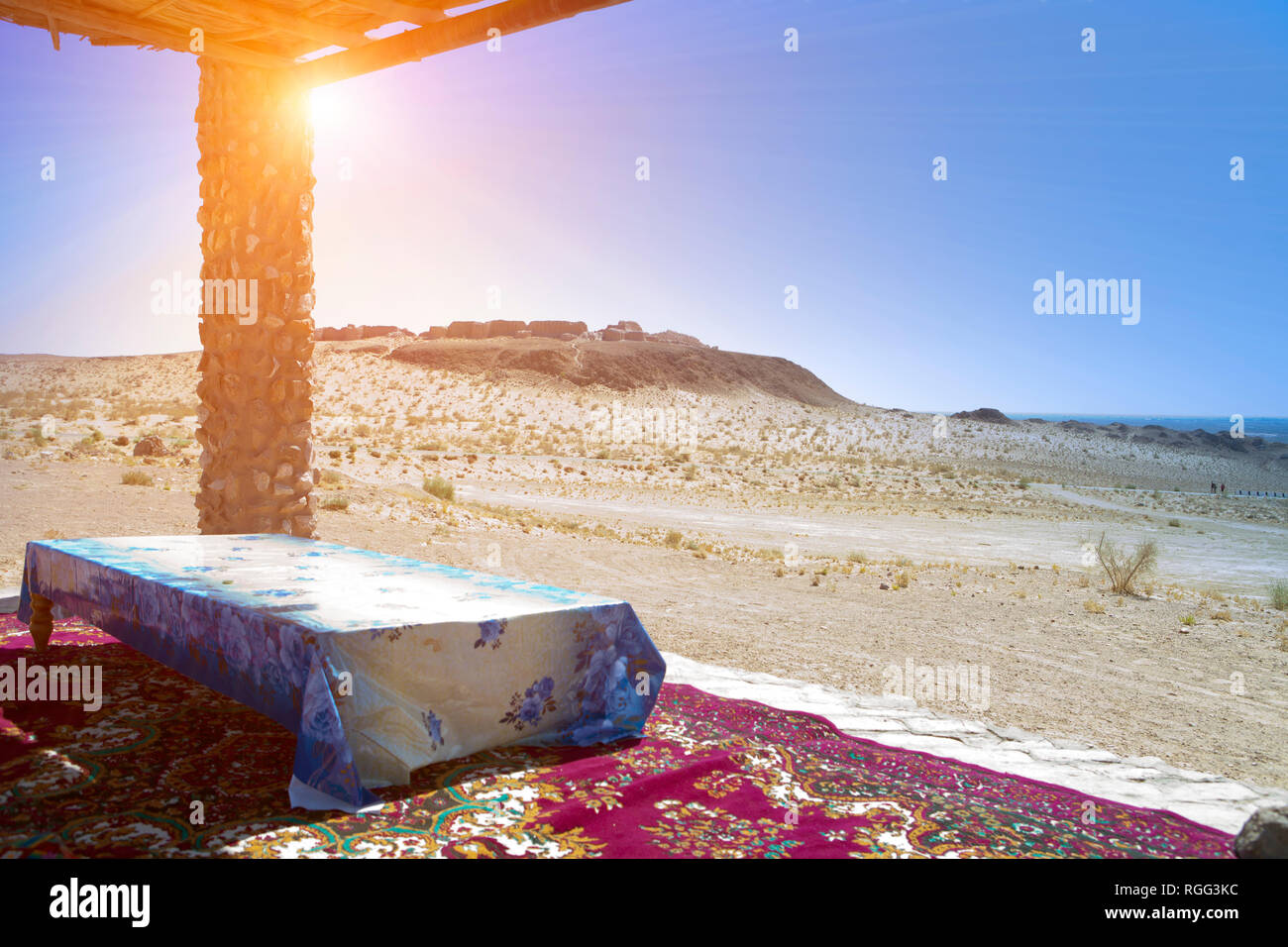 Bed under a canopy for rest in the shade in the desert near the ancient ...