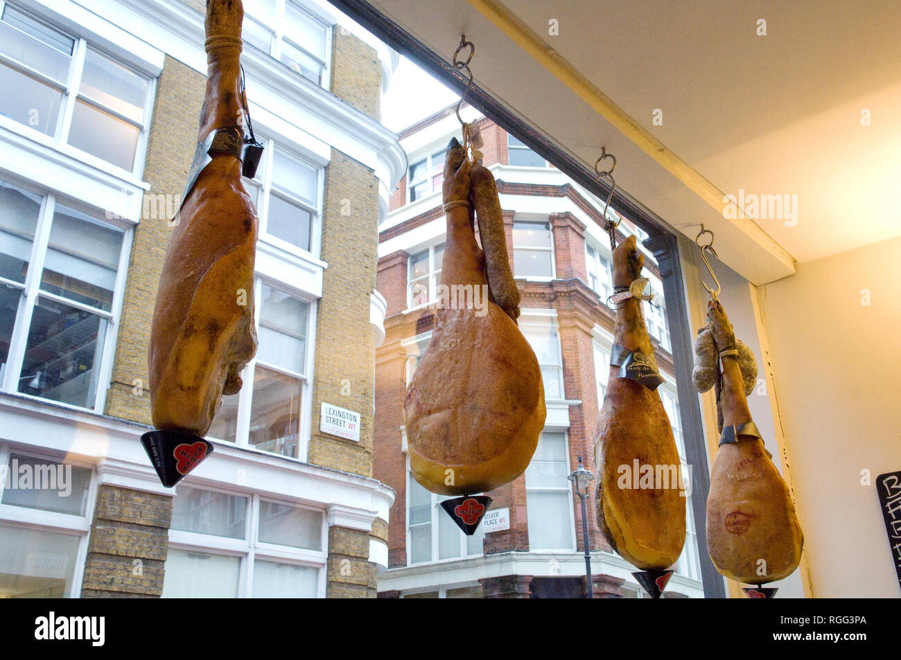 hams hanging in the window of Fernandez and Wells a deli on lexington ...