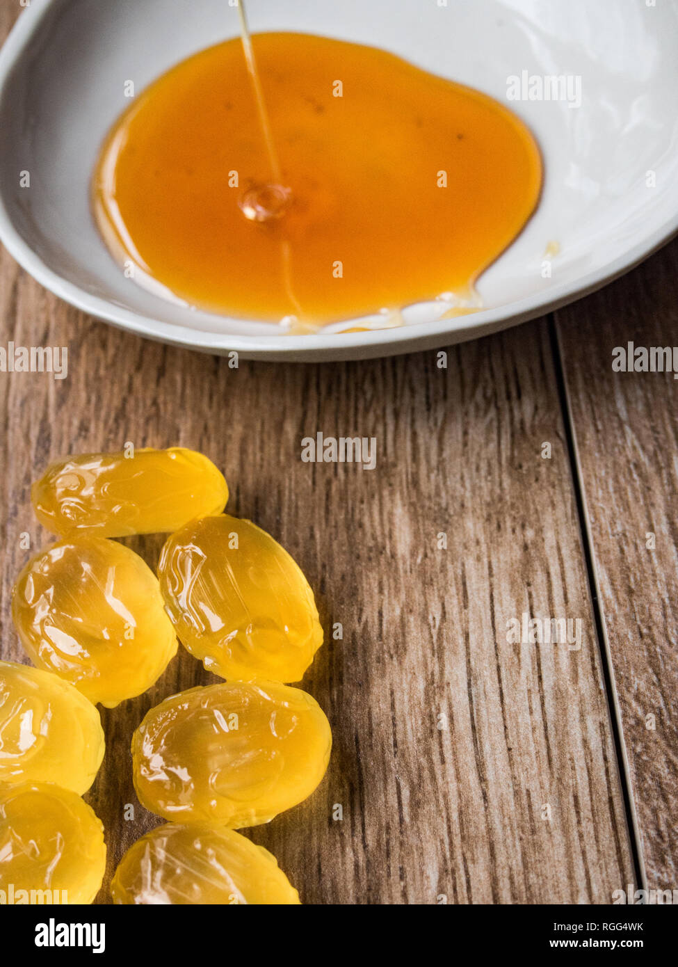 Honey candies on wood background Stock Photo - Alamy