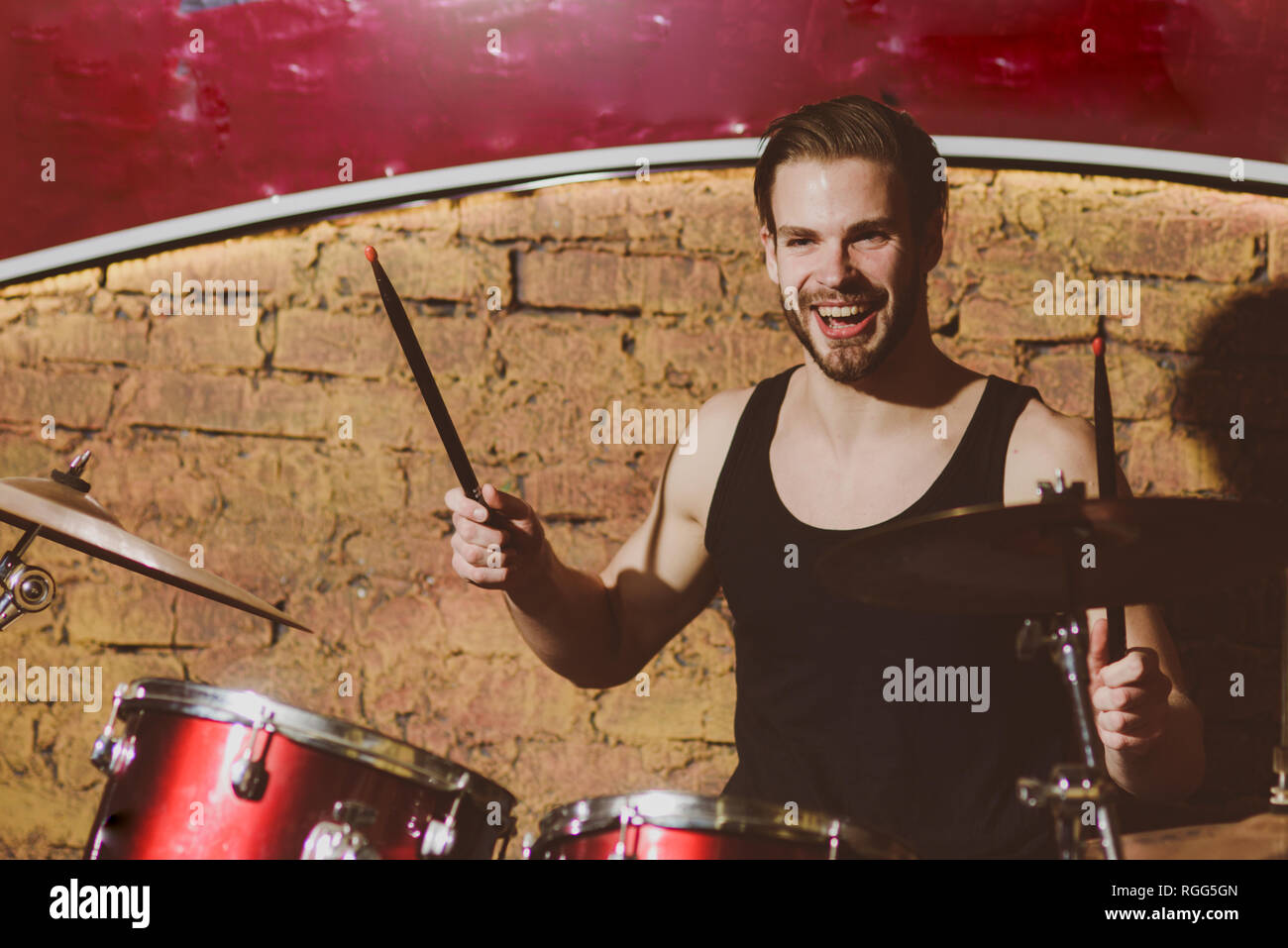 Live to drum, drum to live. Handsome man play percussion instrument ...