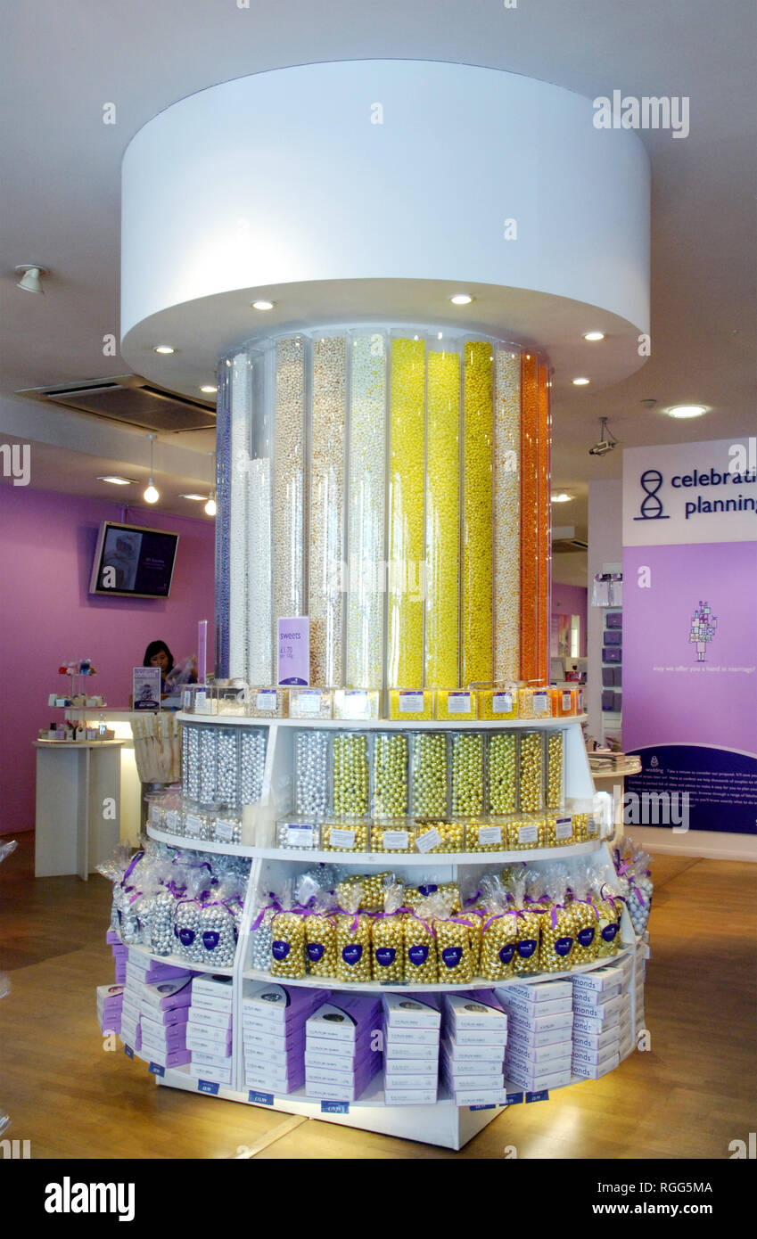 Sweets on sale in a gravity fed giant dispenser Stock Photo - Alamy