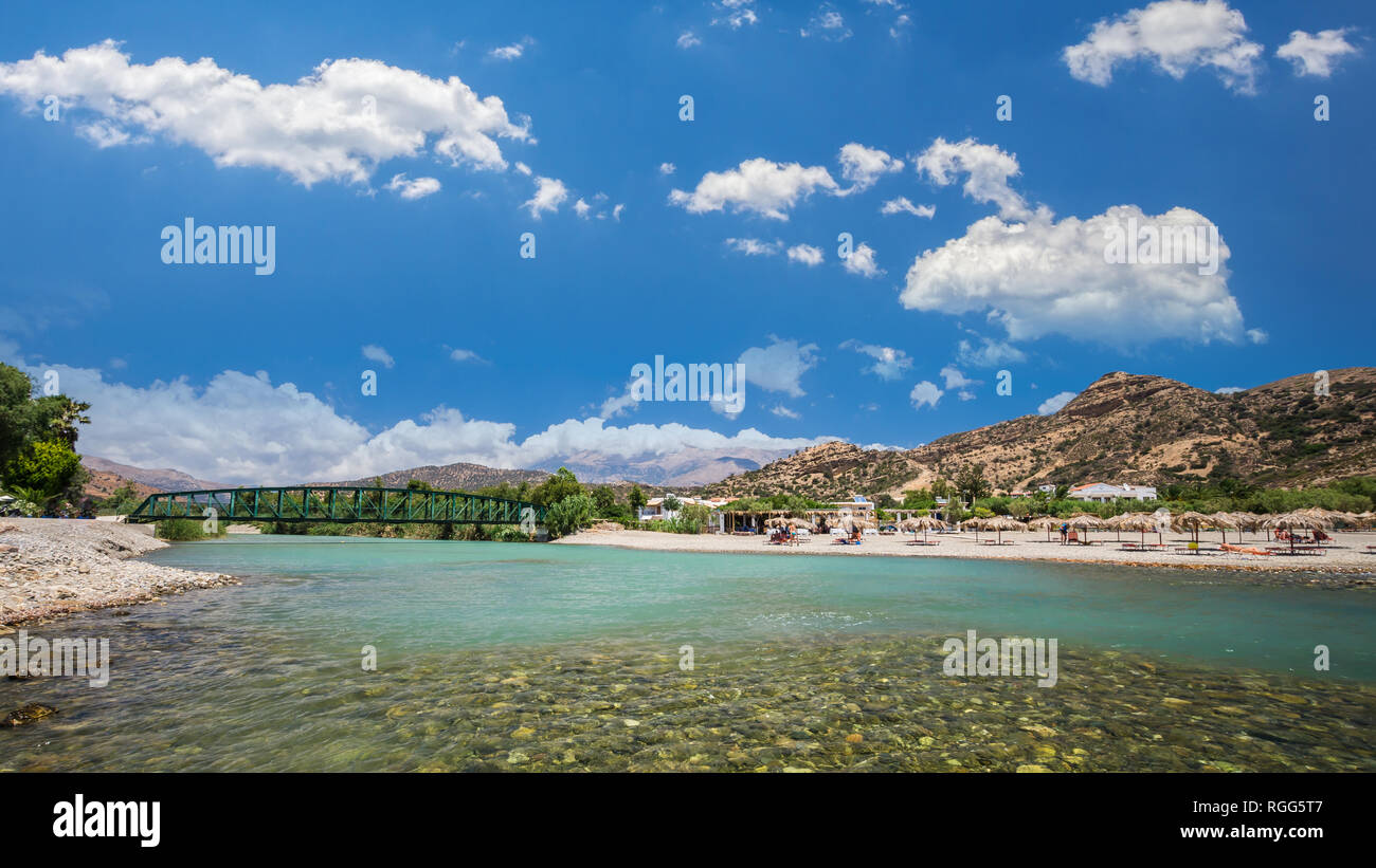 Agia Galini Beach in Crete island, Greece. Tourists relax and bath in ...