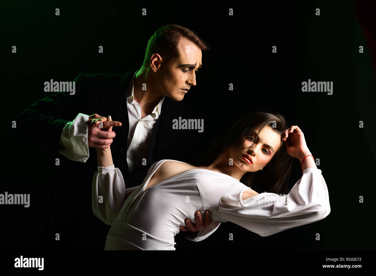 Making your heart flutter. Mime man and woman act in romantic scene ...