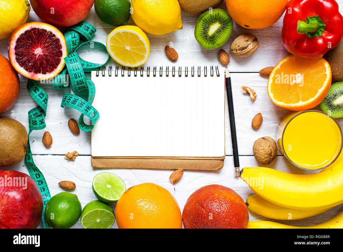 fresh fruits and vegetables with nuts for healthy diet on white wooden ...