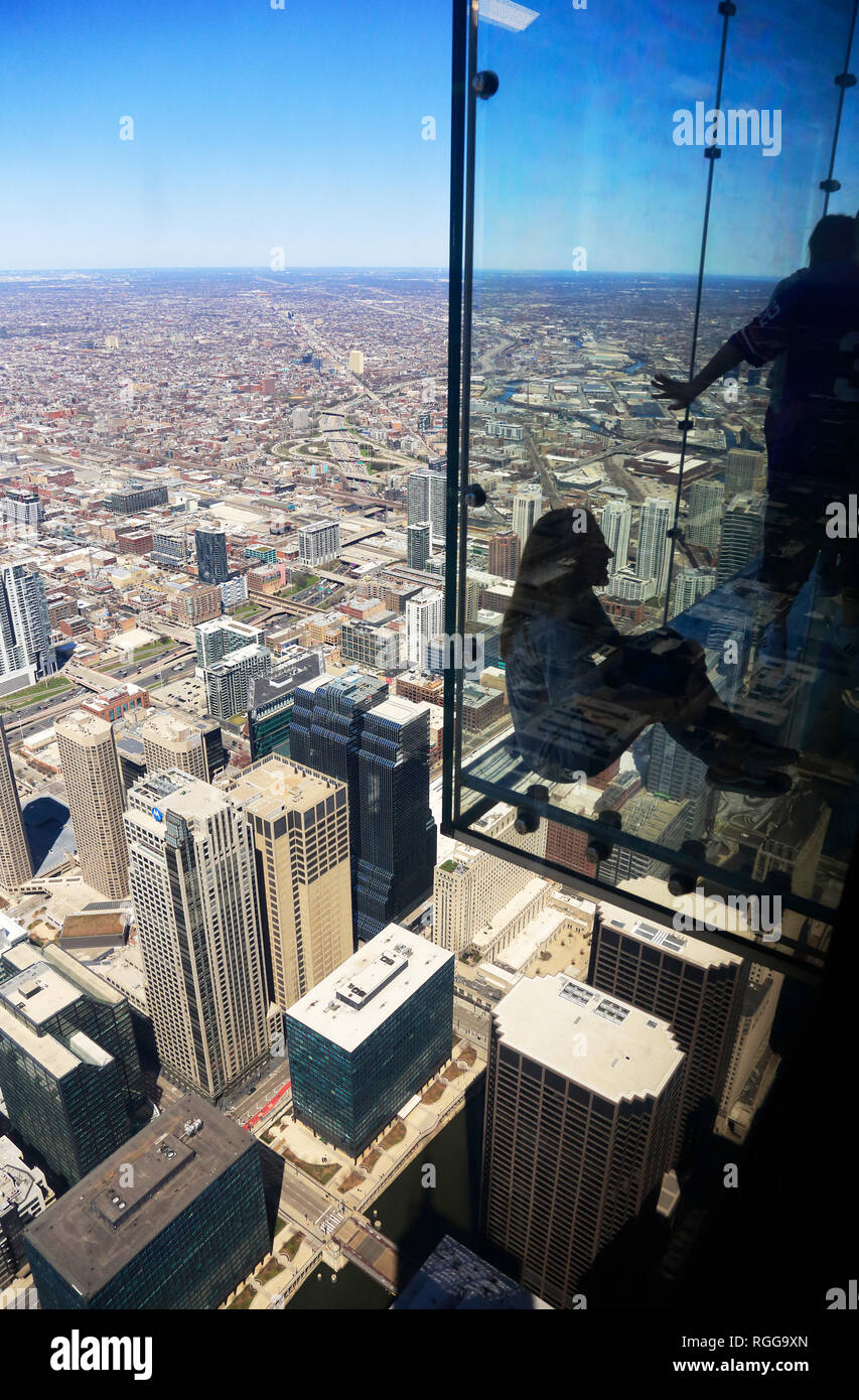 Tourists on The Ledge of the Skydeck observation deck on top of the ... Tourists on The Ledge of the Skydeck observation deck on top of the ...