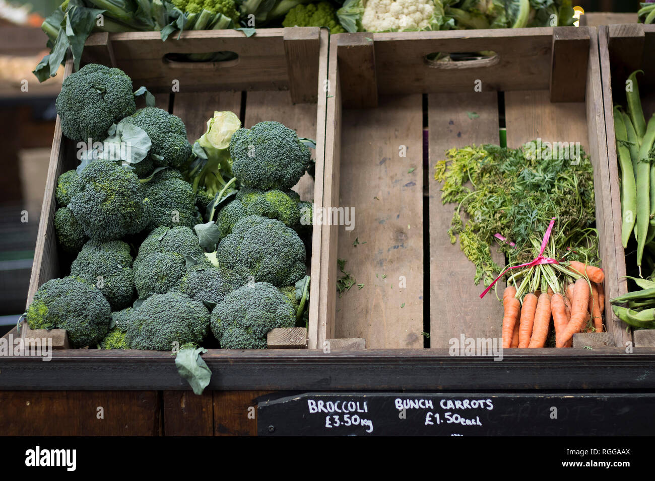 Organic vegetables including carrots, broccoli and broad beans on sale ...