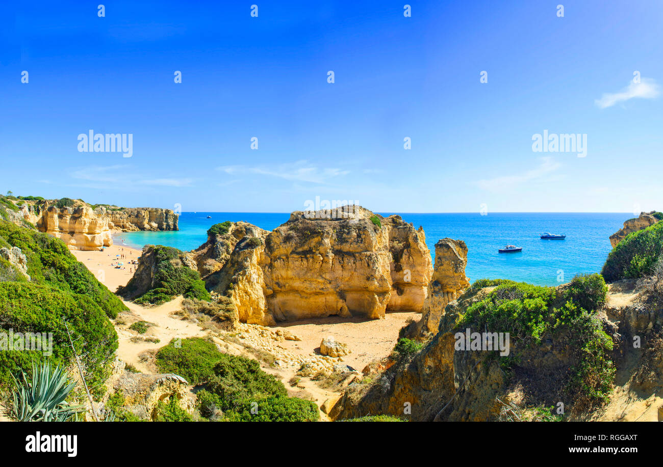 panoramic view of beautiful sandy beach Pria do Castelo with cliff and ...