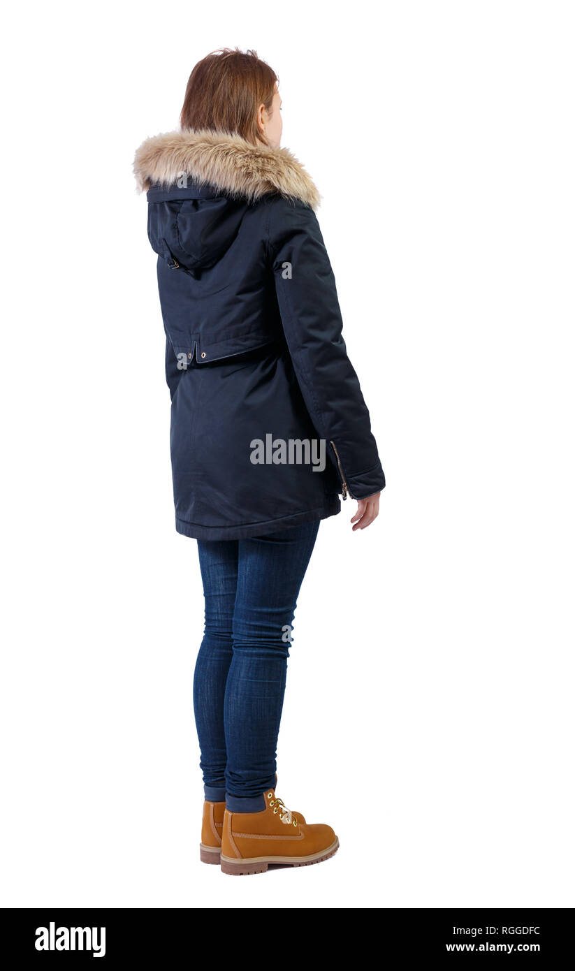 Back view woman in winter jacket. Standing young girl in parka. Rear ...