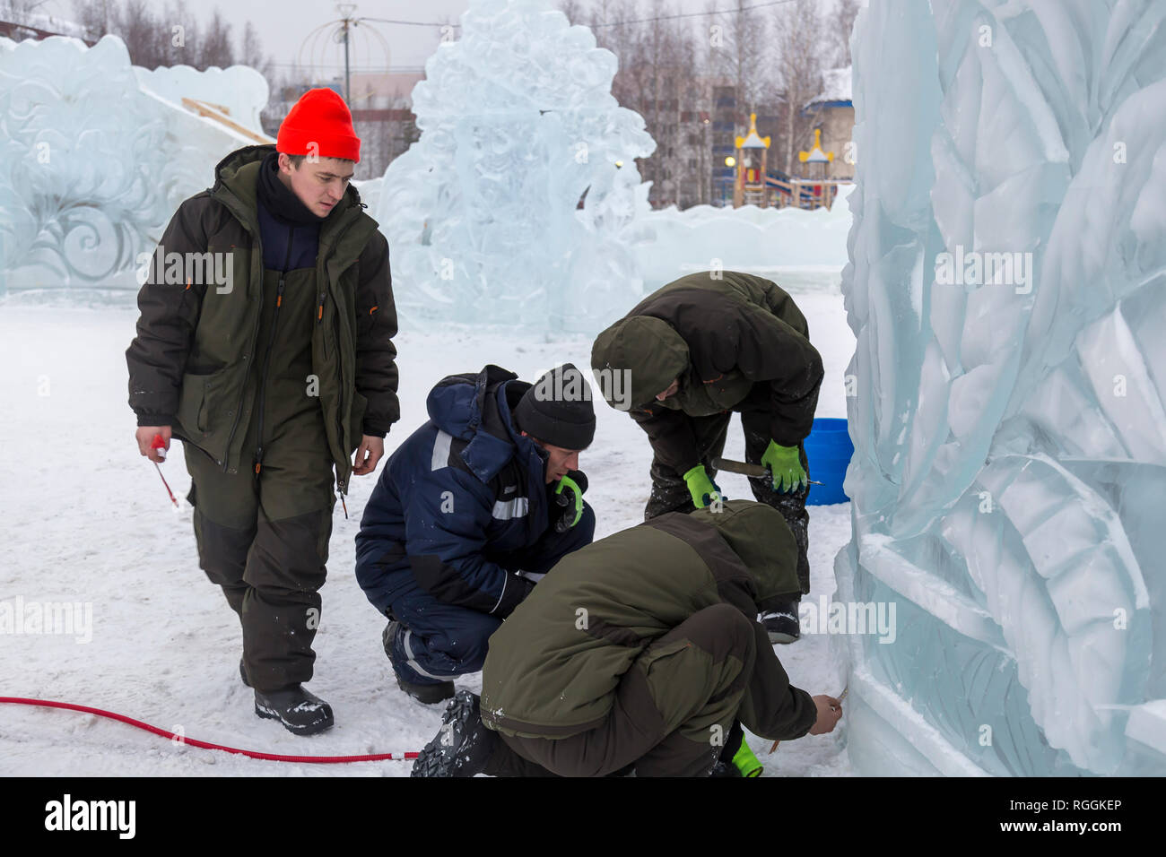 Electricians mount a power cable to illuminate ice figures Stock Photo ...