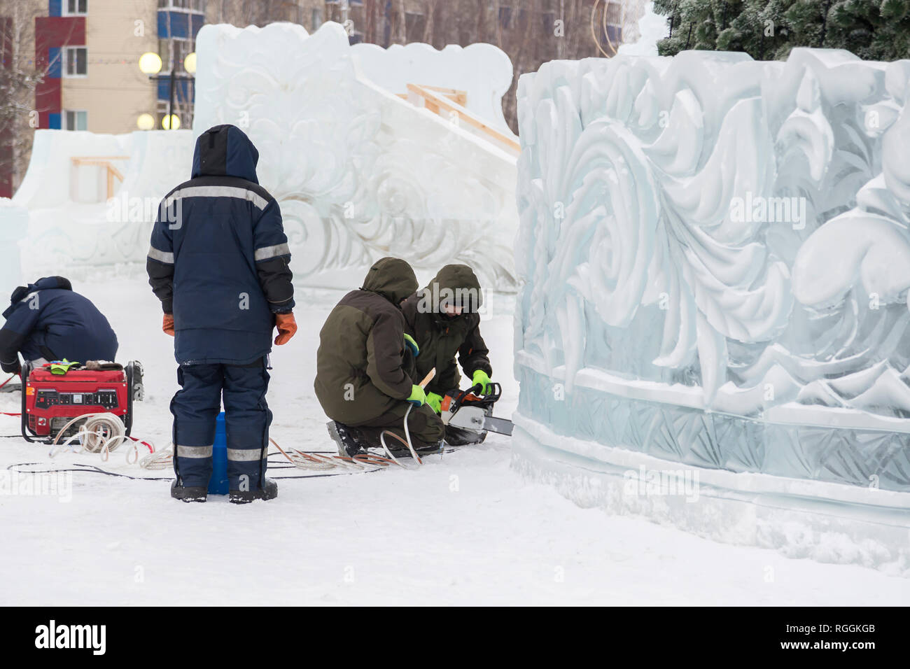 Electricians mount a power cable to illuminate ice figures Stock Photo ...