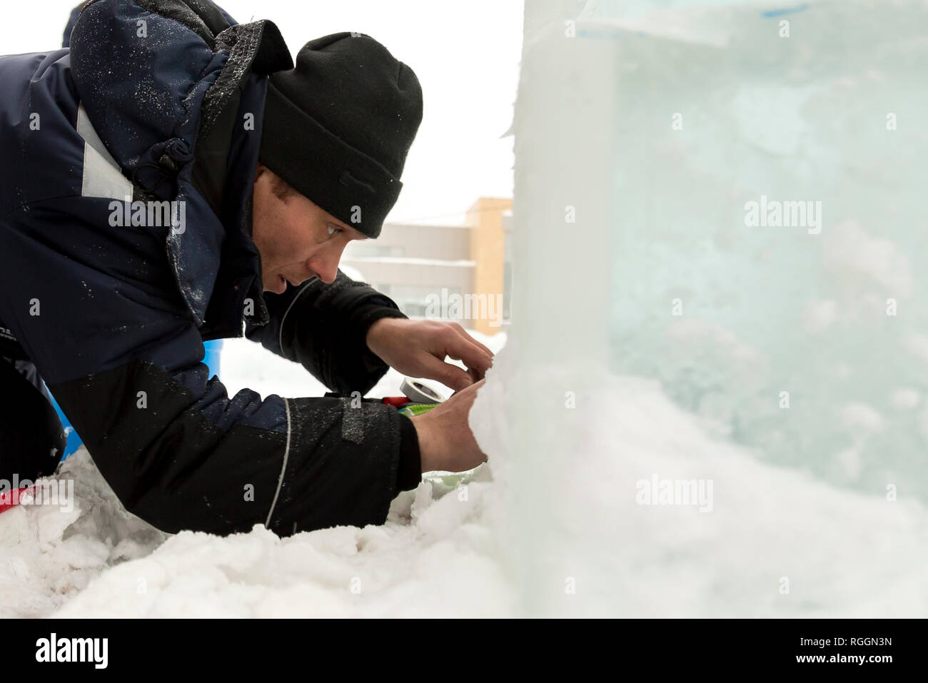 Electrician mounts LED flashlight to illuminate the ice figure Stock ...