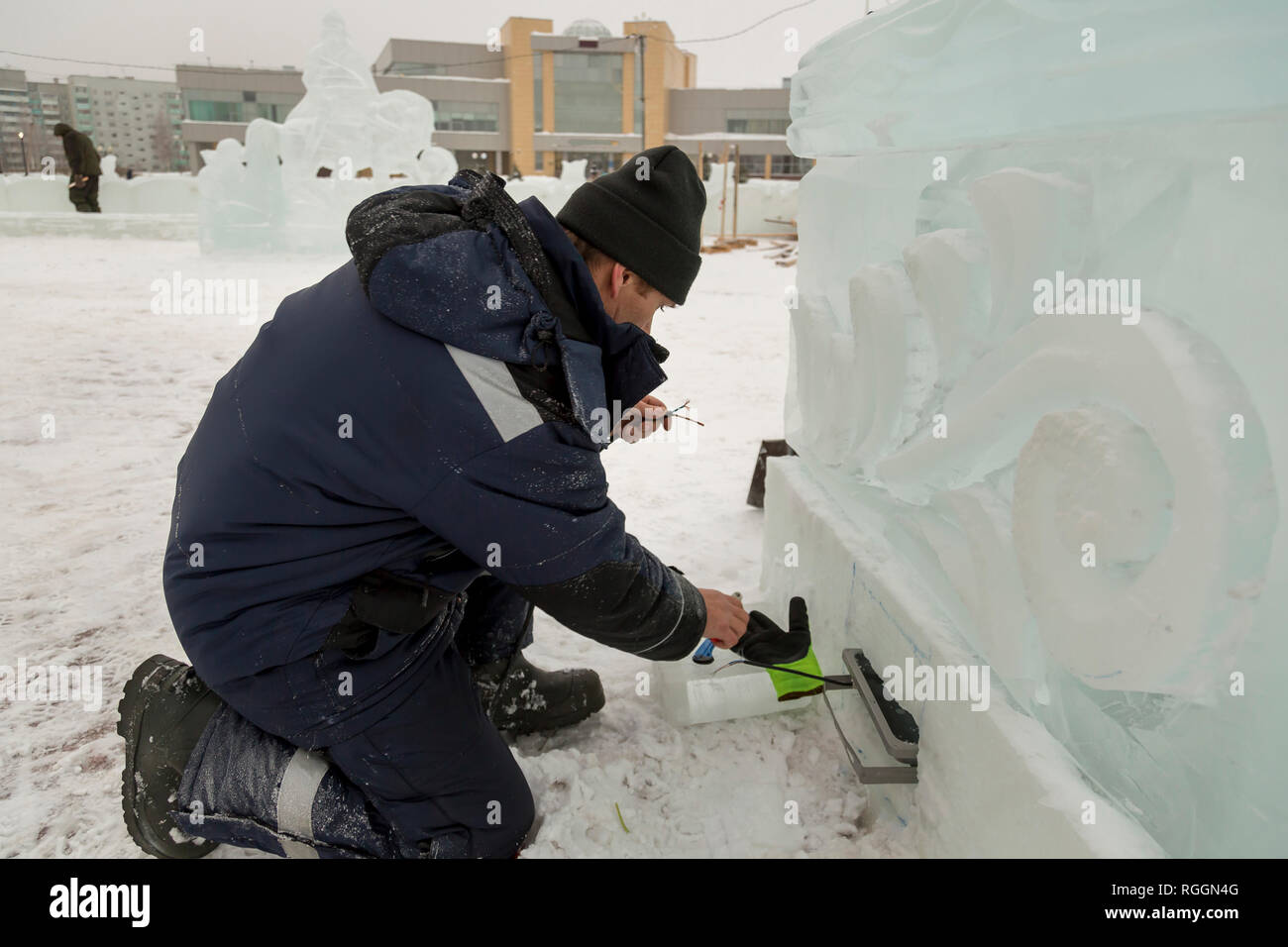Electrician mounts LED flashlight to illuminate the ice figure Stock ...