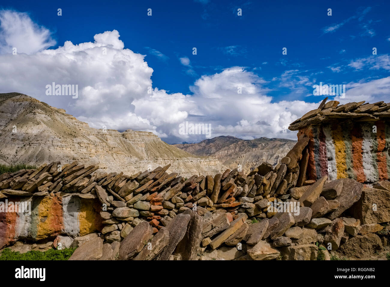 Barren alpine landscape with a colorful Mani wall in Upper Mustang ...