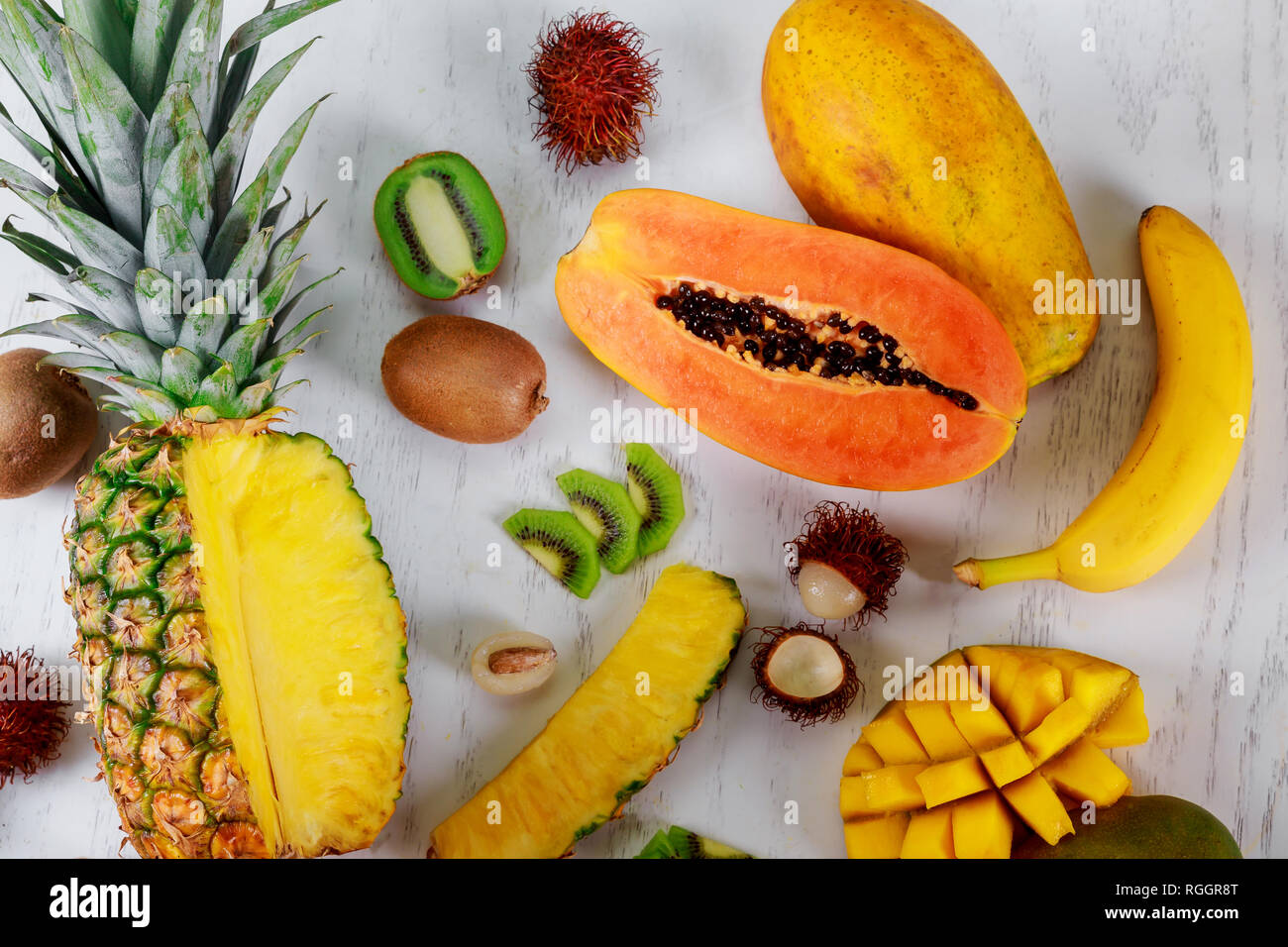 Ripe juicy tropical summer seasonal fruits mango papaya pineapple kiwi ...