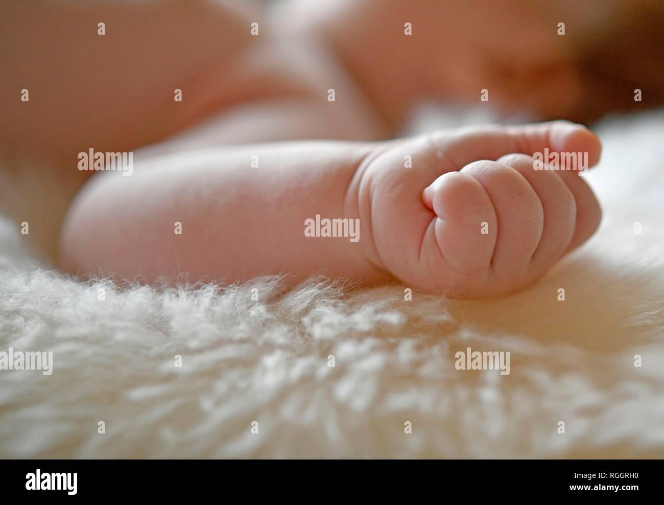 Infant hand hi-res stock photography and images - Alamy