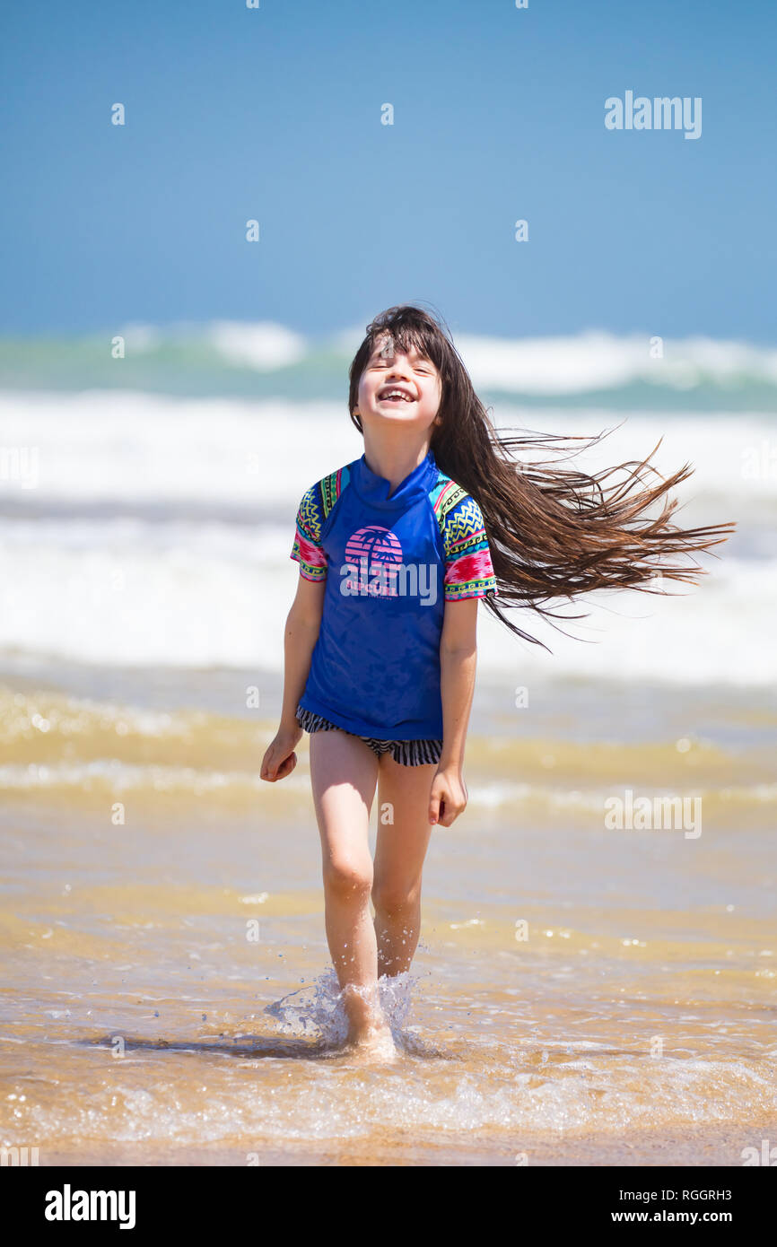 Happy Kids on Beach Stock Photo - Alamy
