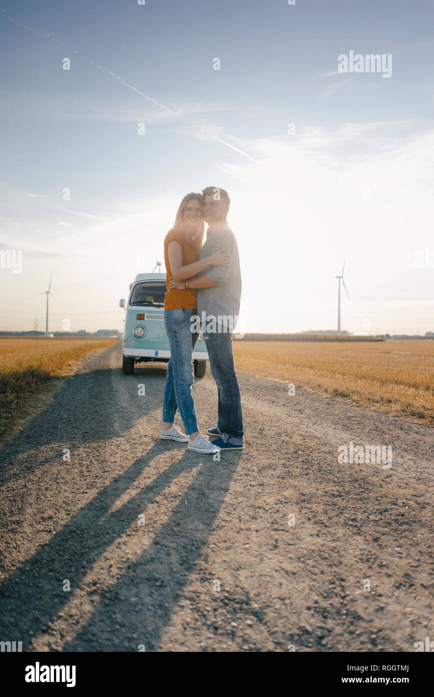 Couple hugging camper van hi-res stock photography and images - Alamy