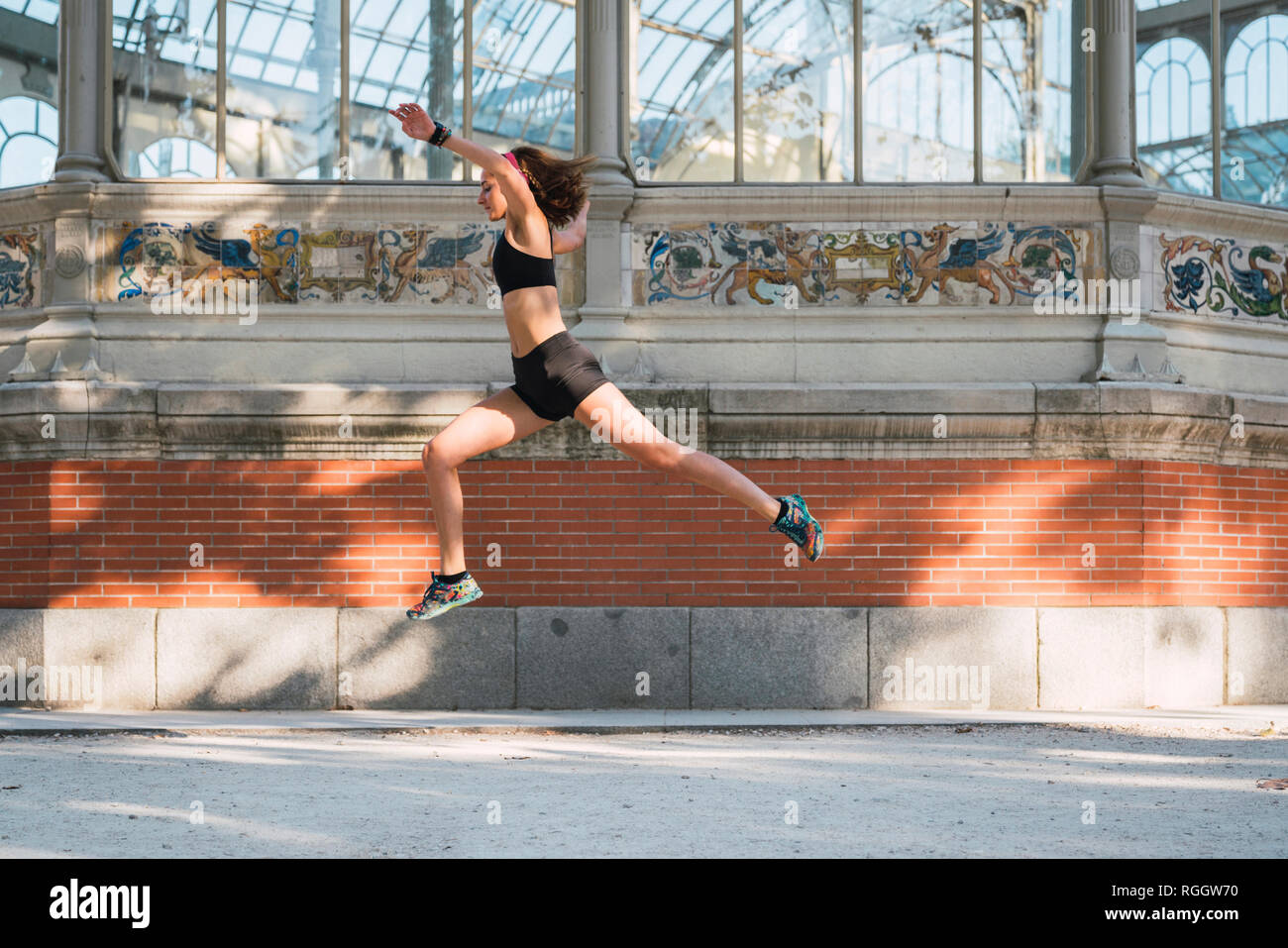 Sporty young woman jumps hi-res stock photography and images - Alamy