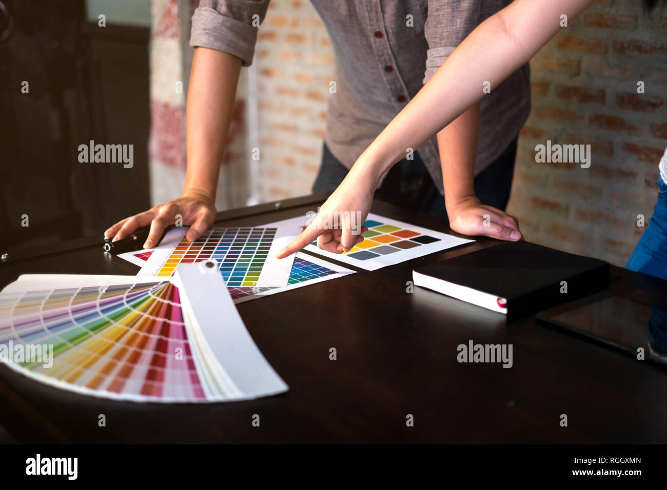 Graphic designers choose colors from the color bands samples for design ...