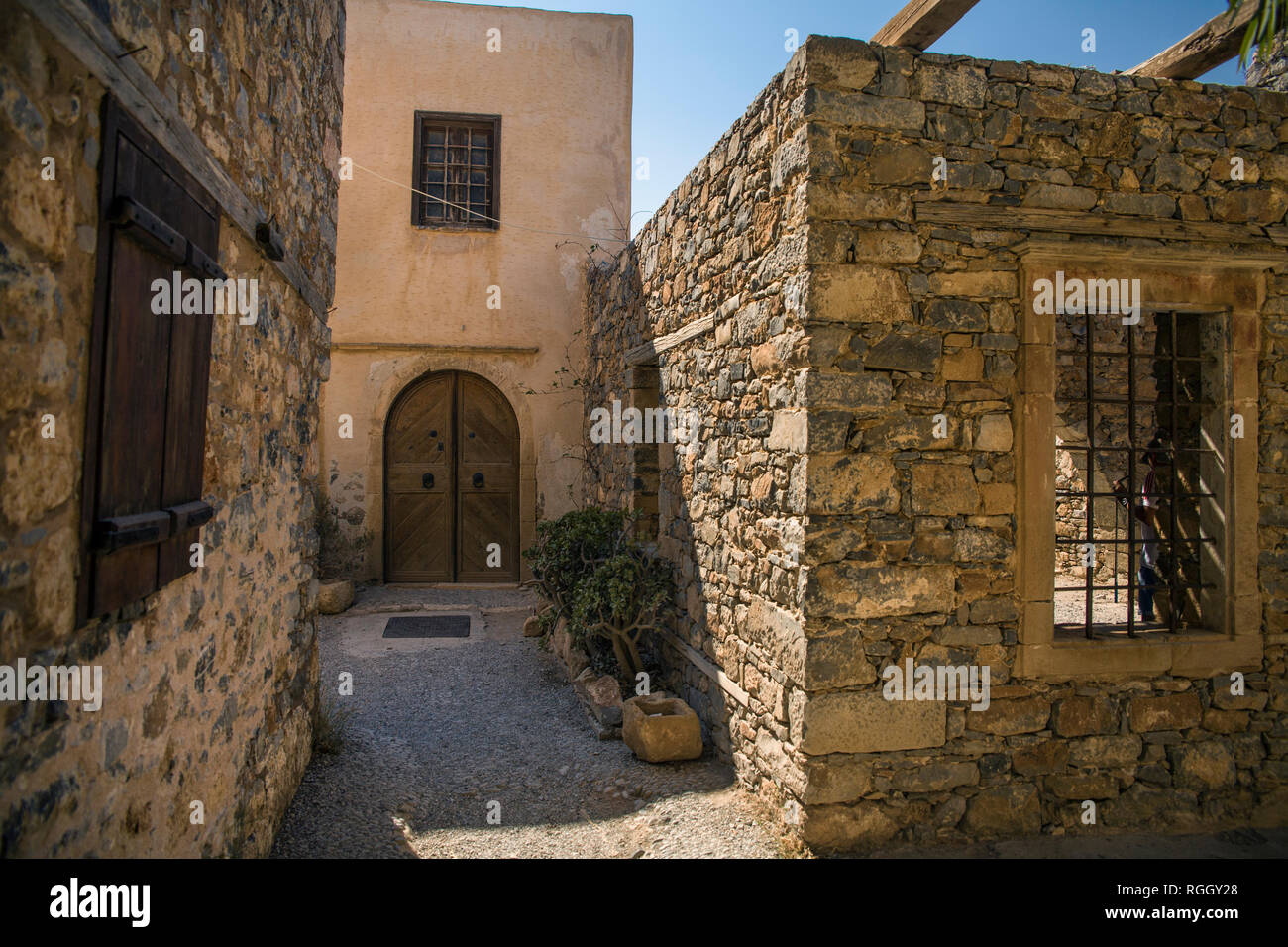 Historic buildings on the island in the fortress of Spinalonga in Crete ...