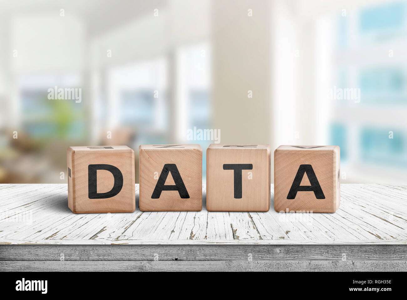 Data sign on a table with white planks in a bright room in daylight ...
