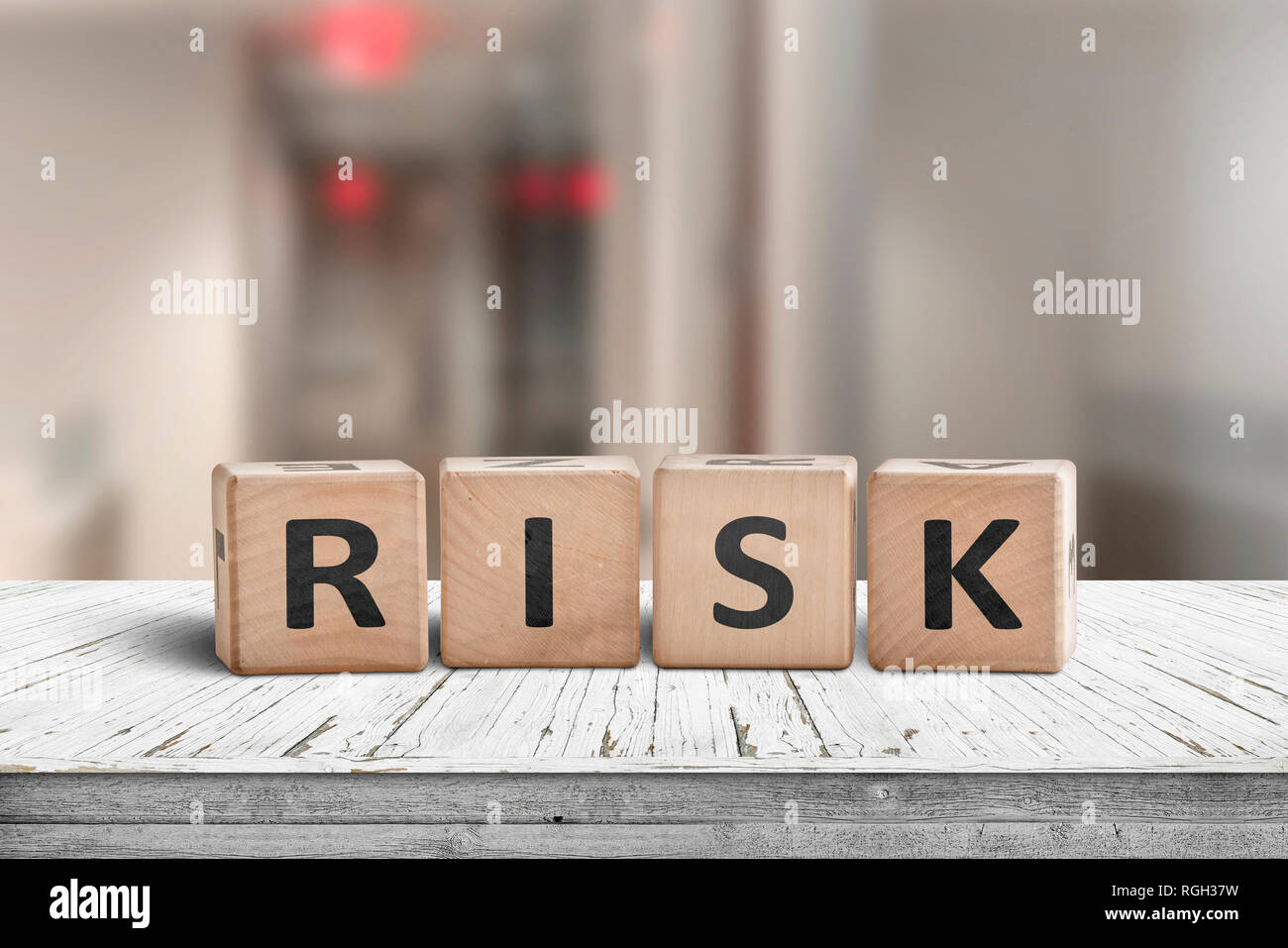 Risk sign on a wooden desk with red lights on in a hallway Stock Photo ...