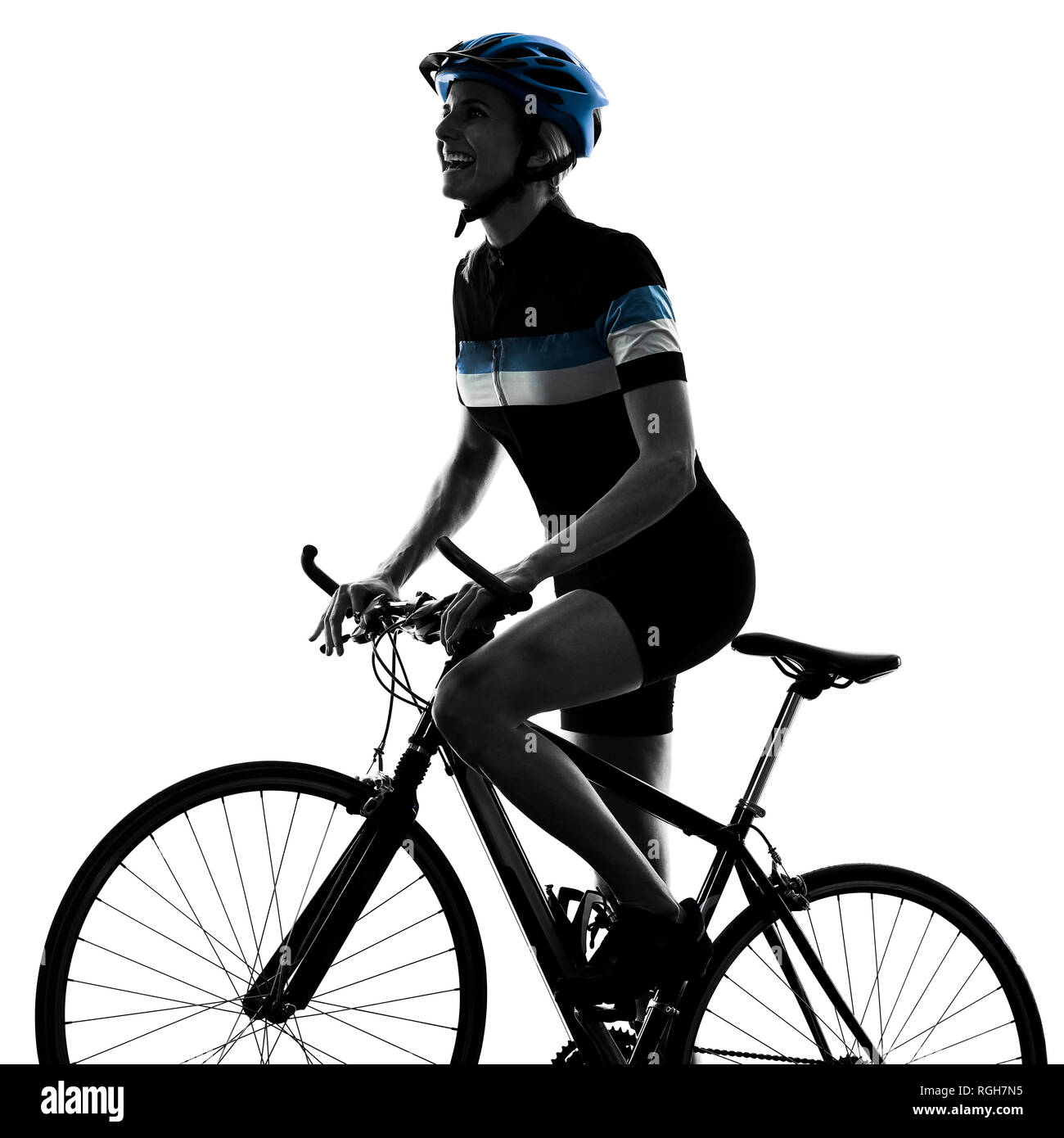 one caucasian cyclist woman cycling riding bicycle in silhouette ...