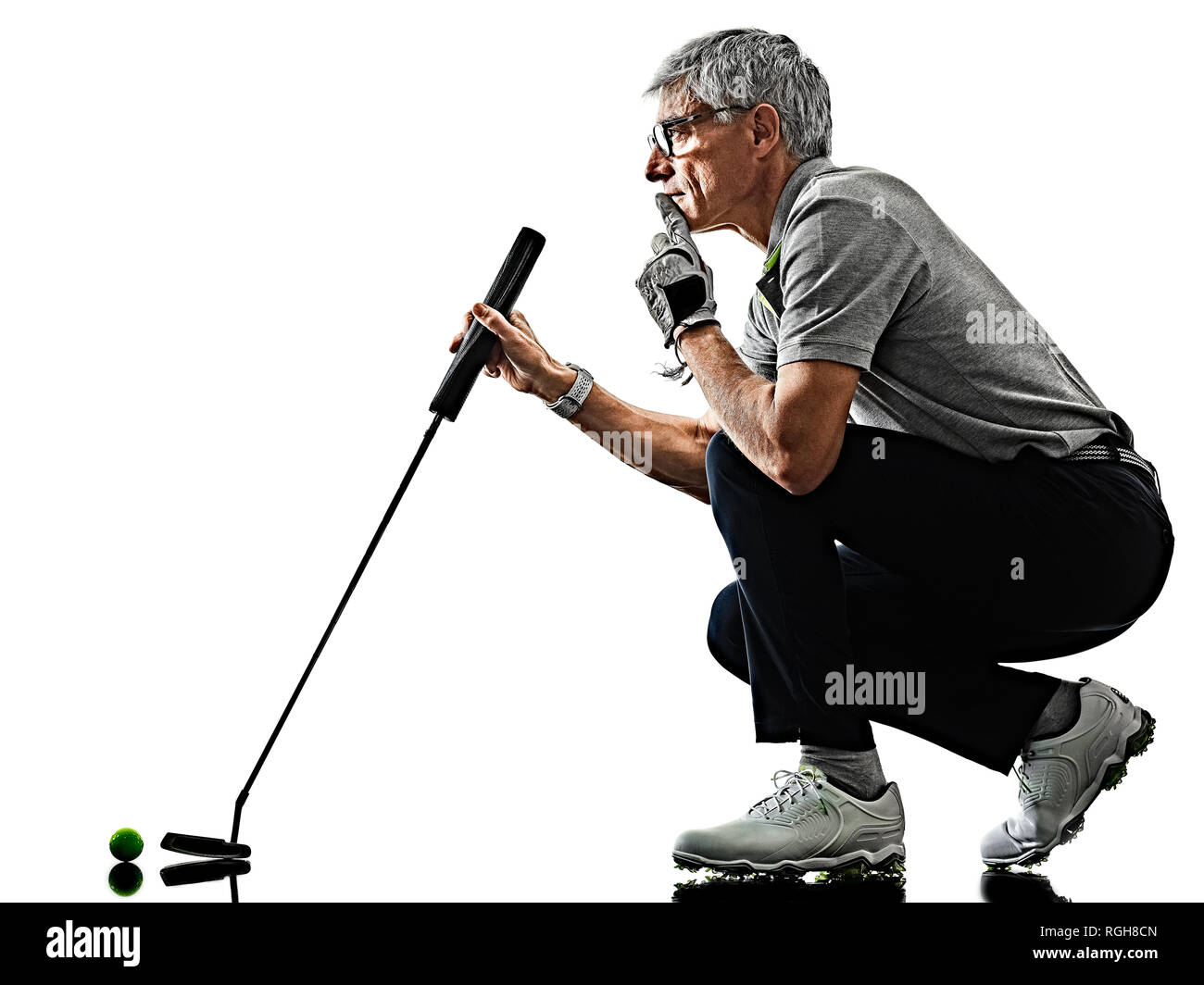 one caucasian senior man golfer golfing in studio shadow silhouette ...