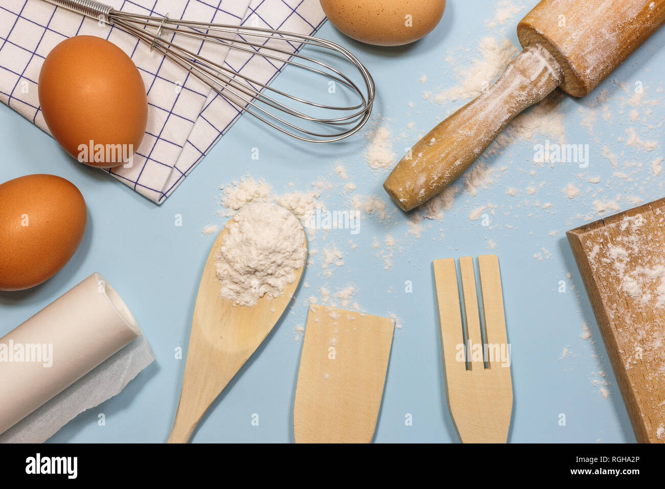 Ingredients and kitchen items for baking cakes. Kitchen utensils, flour ...