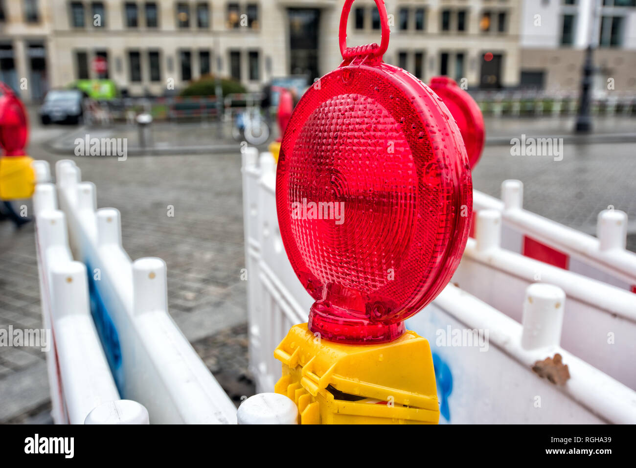 red warning light of temporary road fence Stock Photo - Alamy