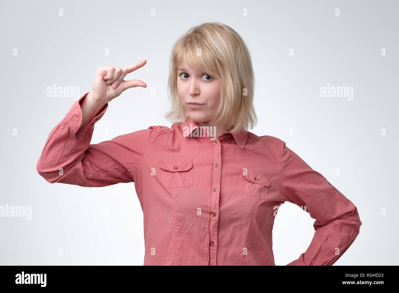 Woman show small hi-res stock photography and images - Alamy