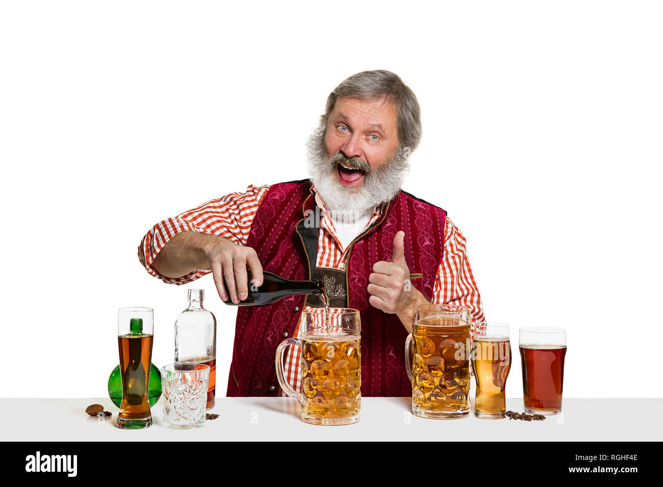 The senior expert male barman with beer at studio isolated on white ...