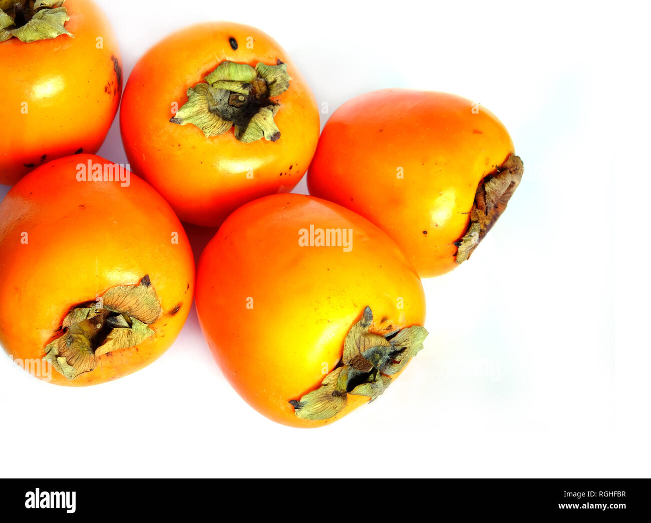 Still life with six ripe big persimmons isolated studio shot top view ...