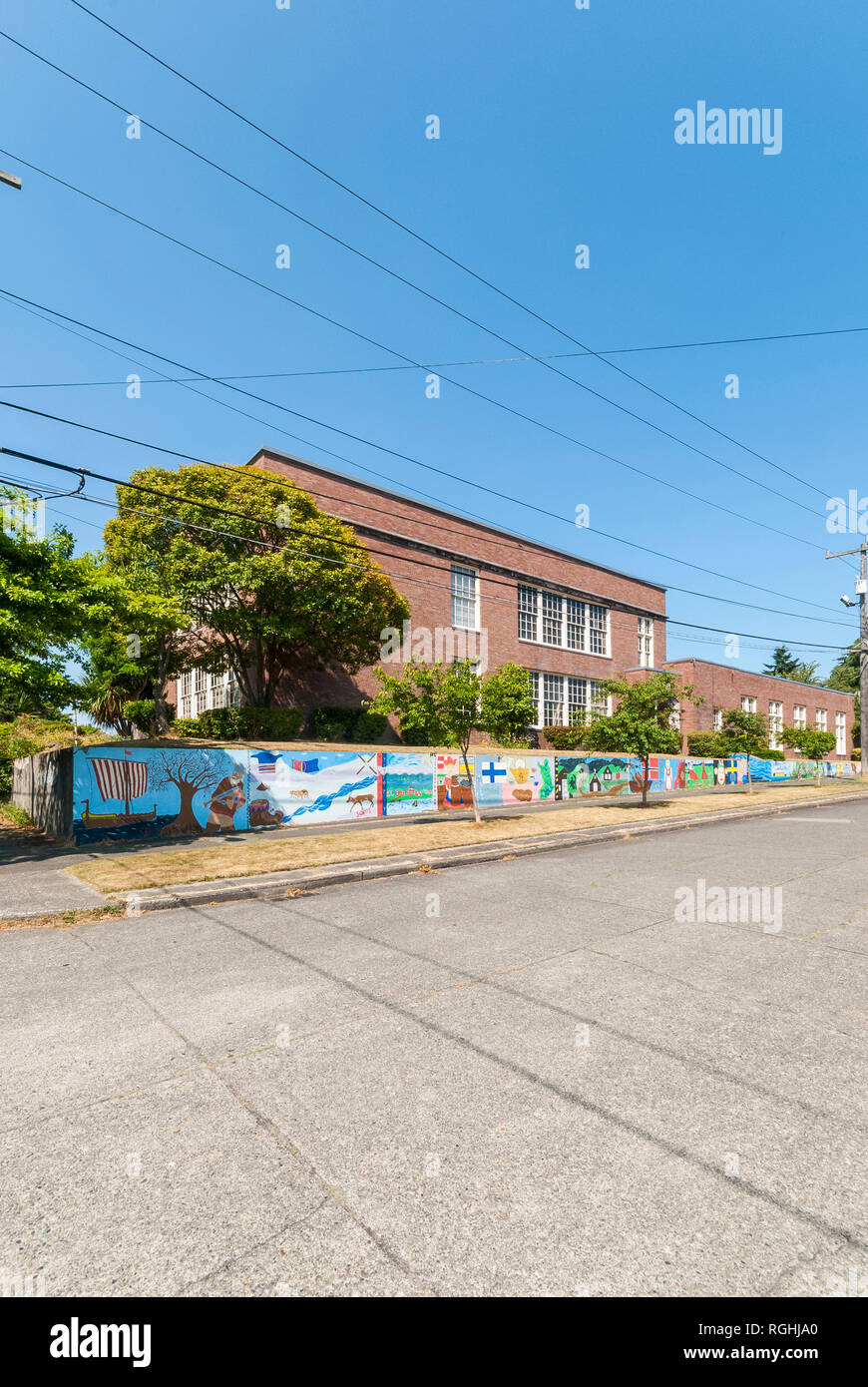 Decorative retaining wall in front of red brick building in Ballard ...