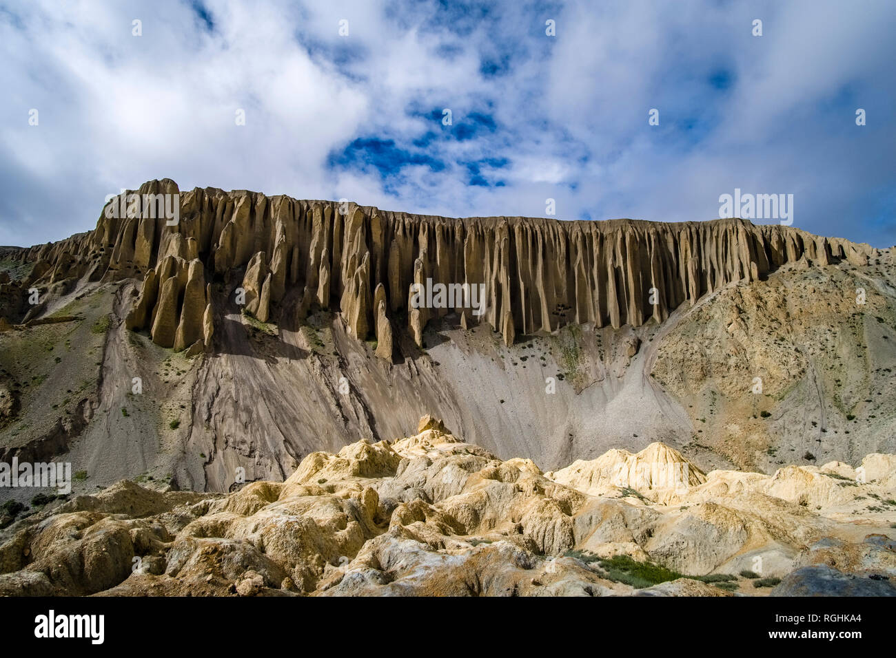 Barren landscape of Upper Mustang, vertically formed rock cliff with ...