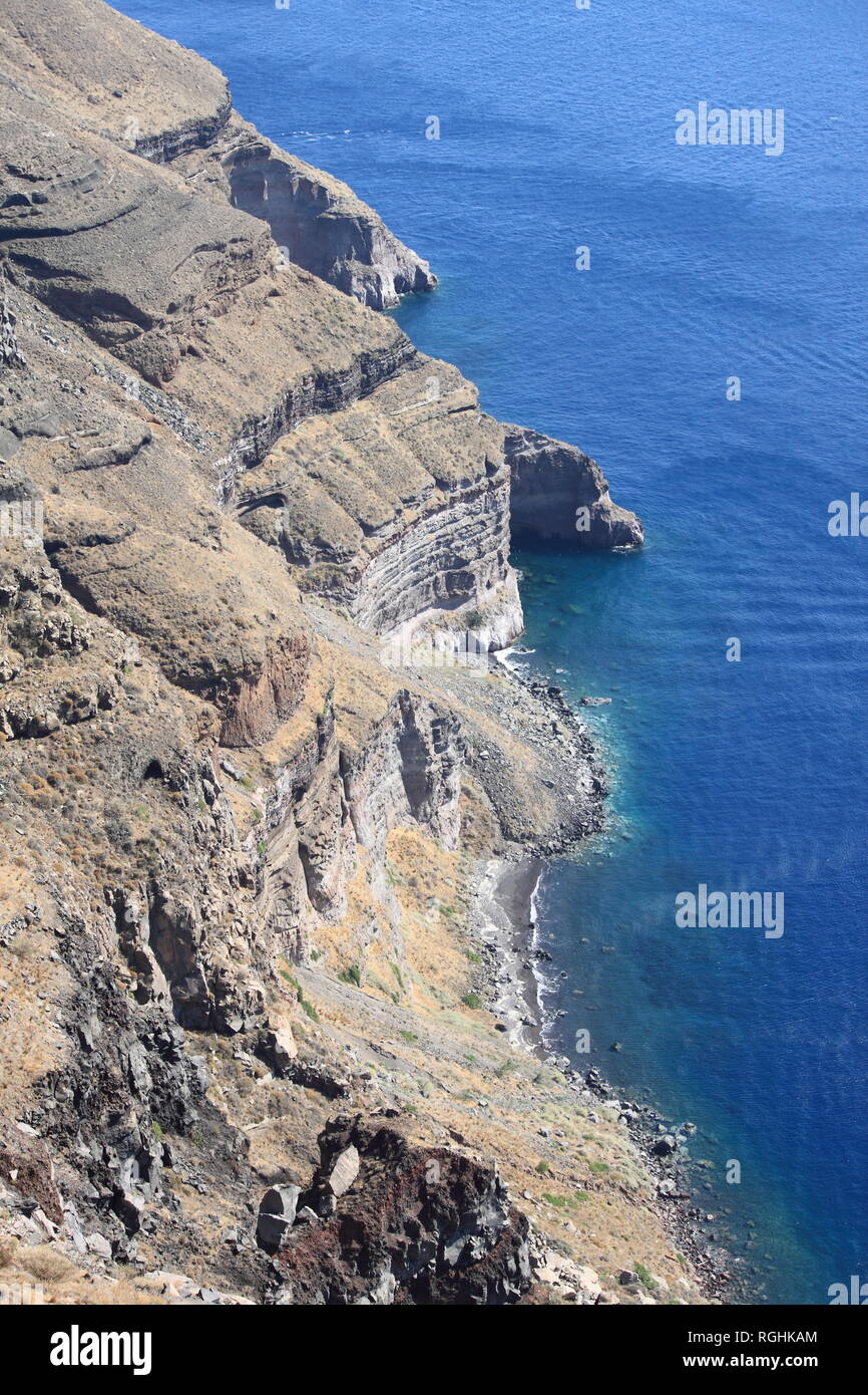 Steep cliff in Santorini island, Greece Stock Photo - Alamy
